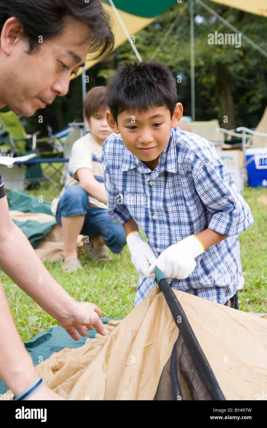 Children setting up tent hi-res stock photography and images - Alamy