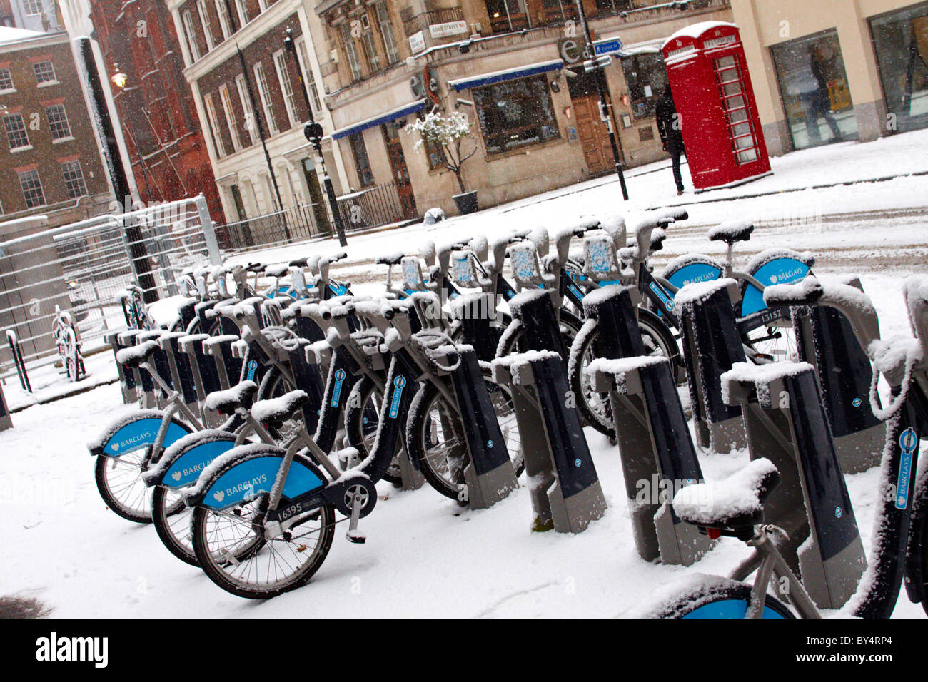 A 'Boris Bike' docking point is covered in snow in Soho Stock Photo - Alamy