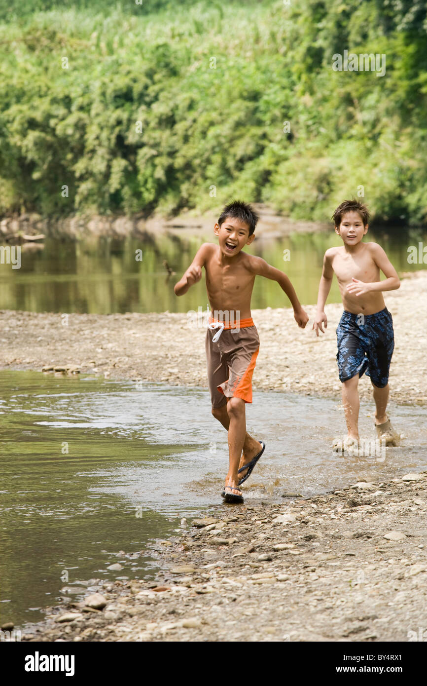 Boys running by river, Chiba Prefecture, Honshu, Japan Stock Photo - Alamy