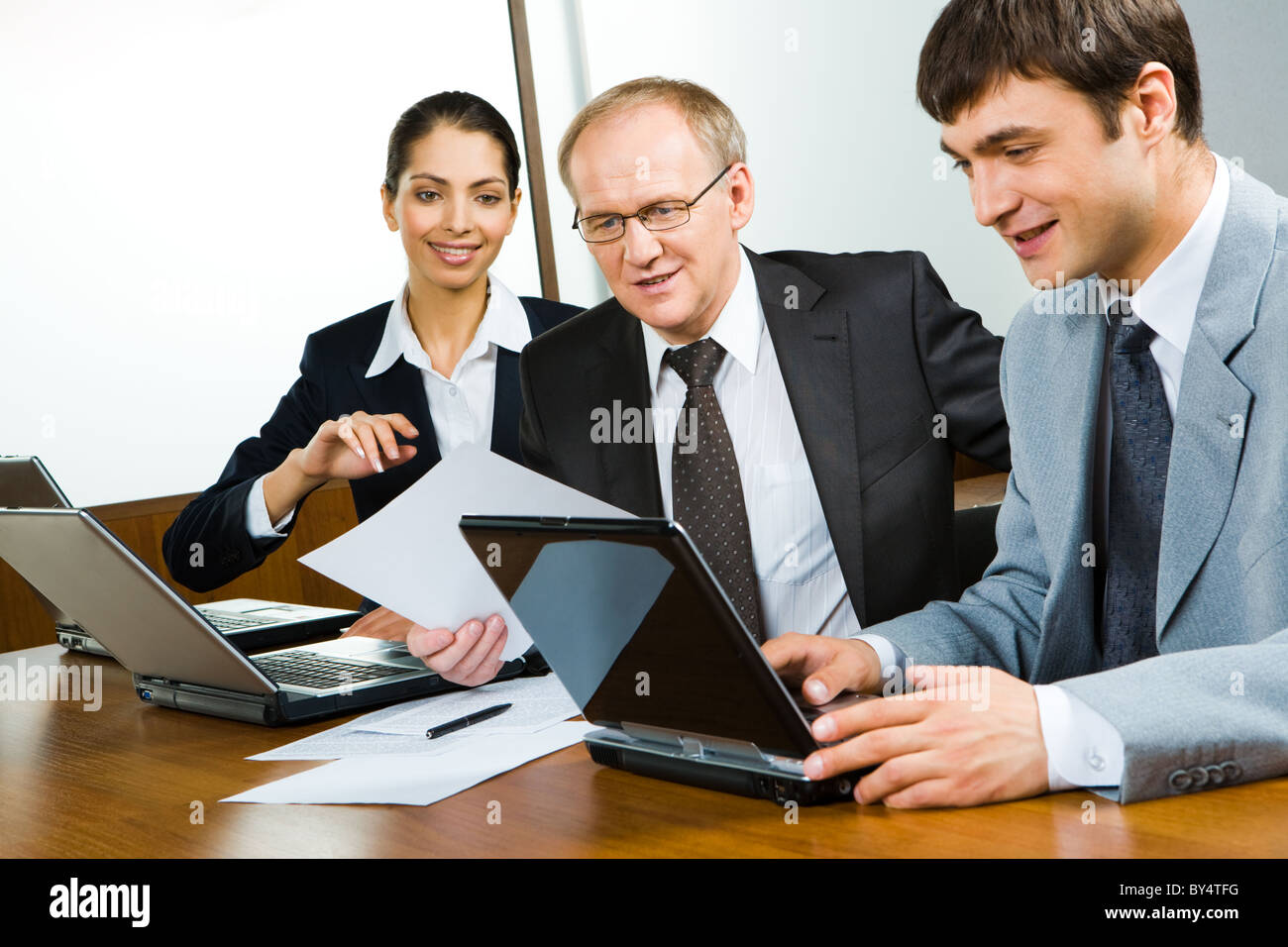 Photo of businessmen working with documents and laptop in the office ...