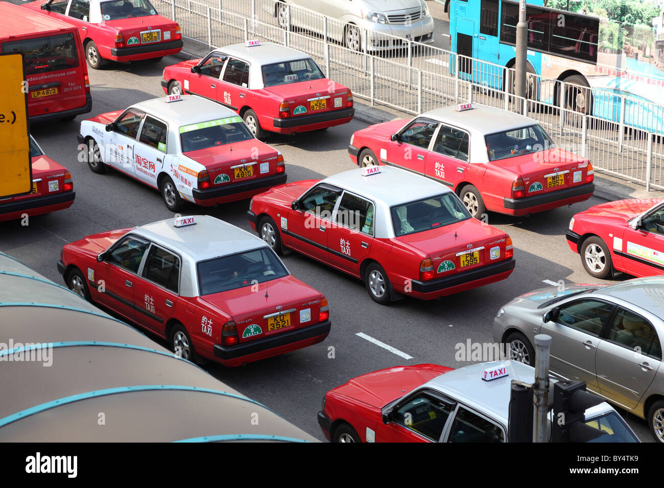 Taxis in the street of Hong Kong Stock Photo - Alamy
