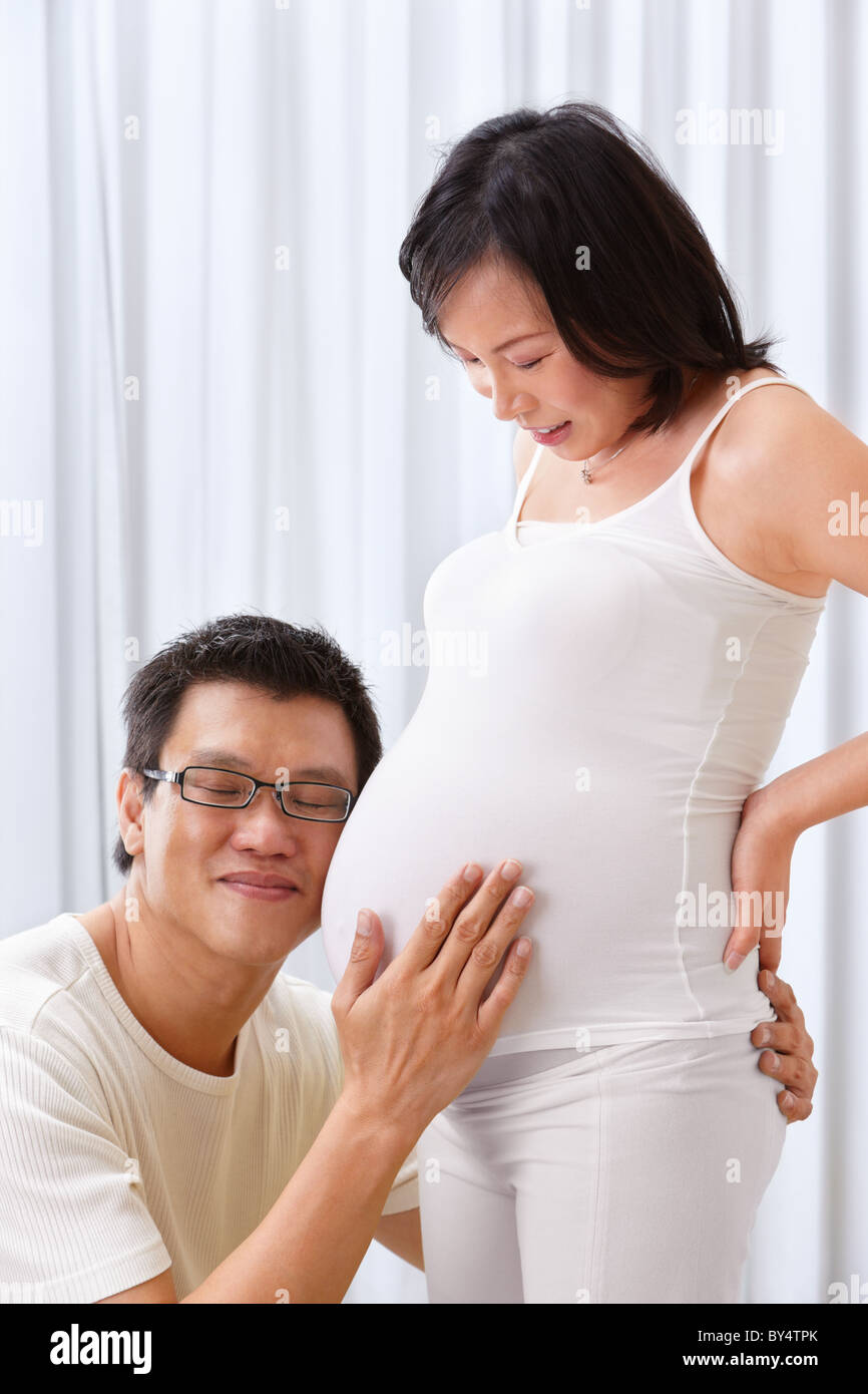 Couple showing their affection to the unborn baby in the womb Stock ...