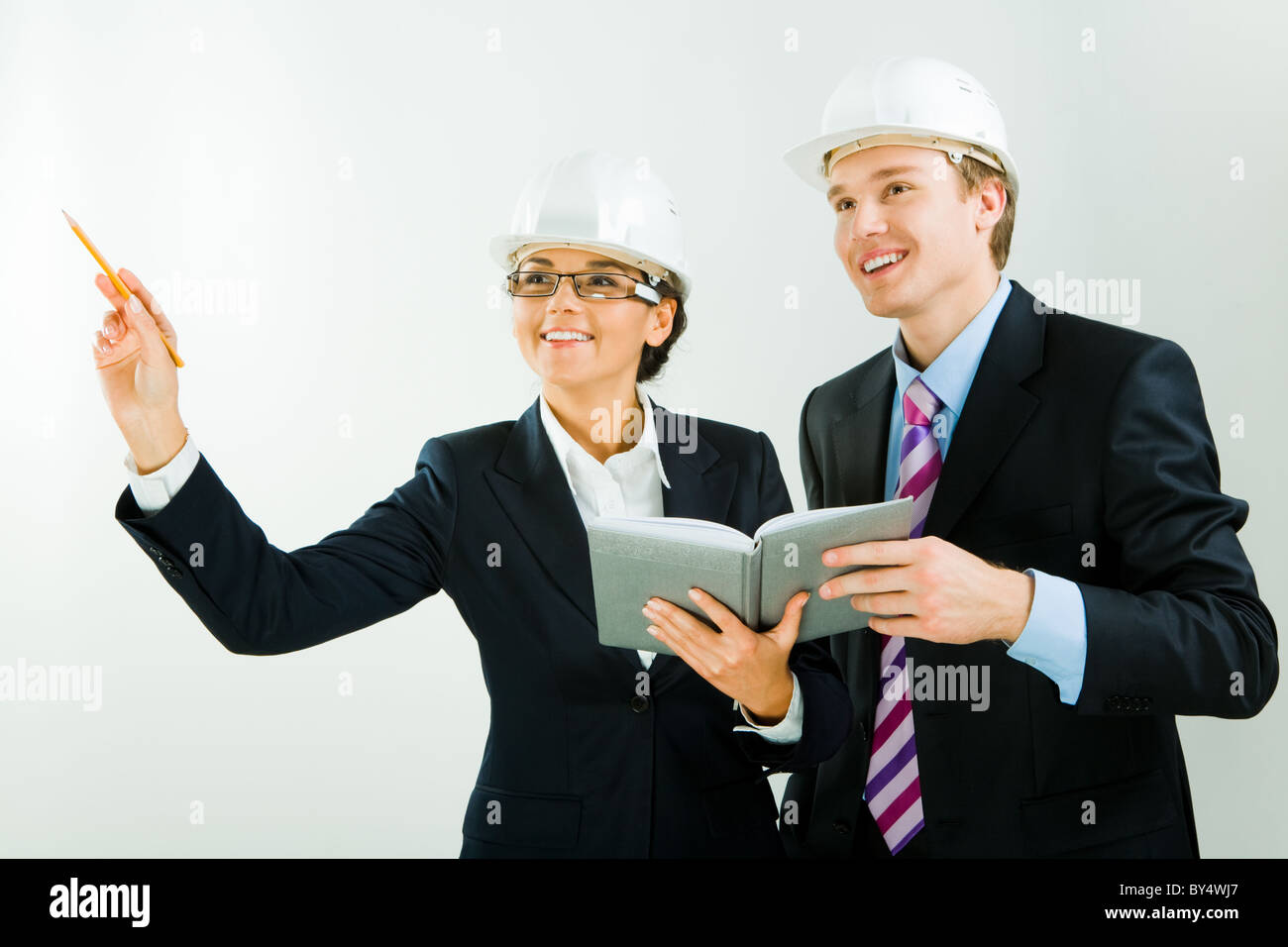Image of business woman raising her hand and holding notepad together ...