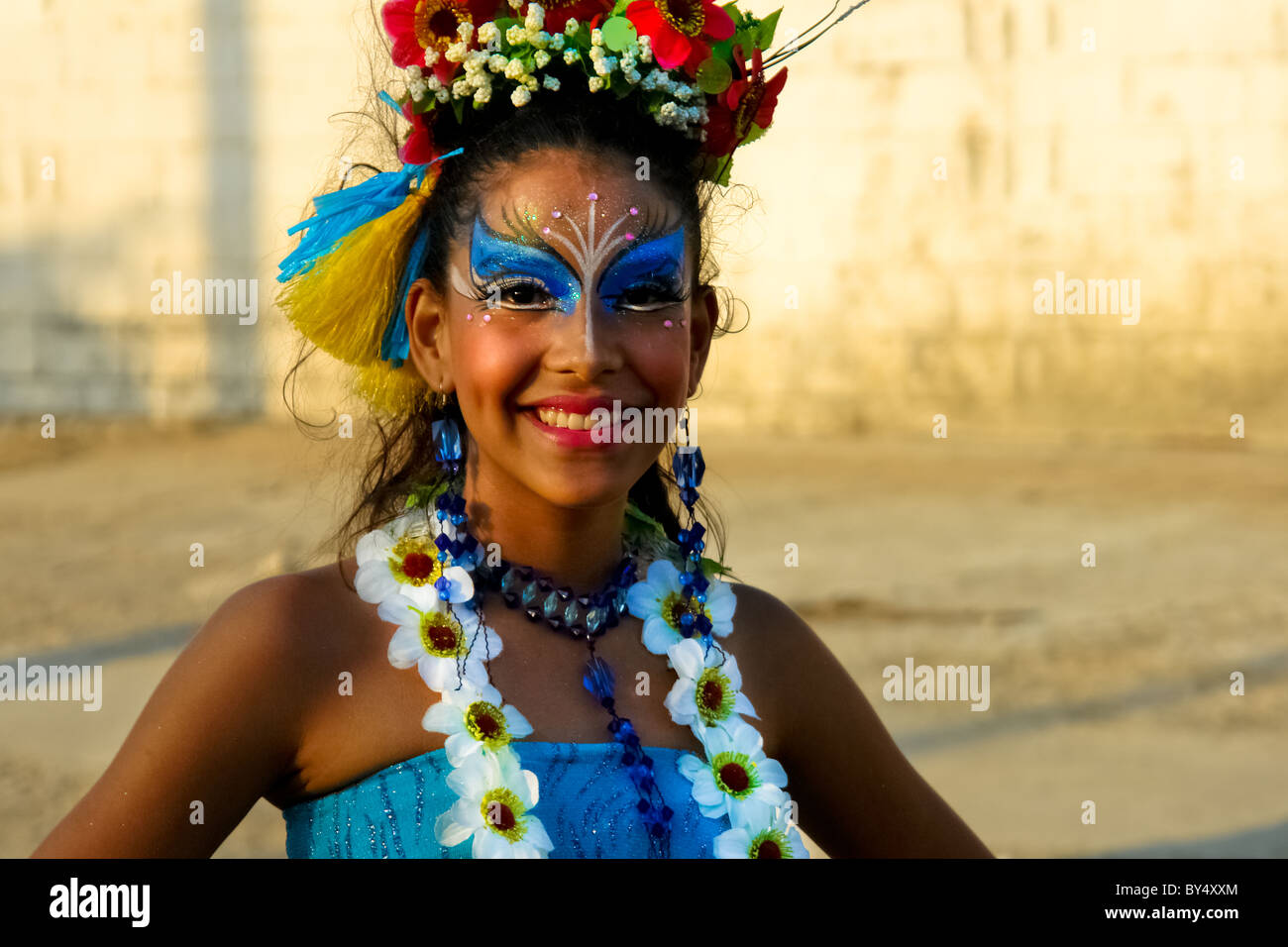 A Colombian Girl Wearing A Colorful Costume And Make Up Dances During