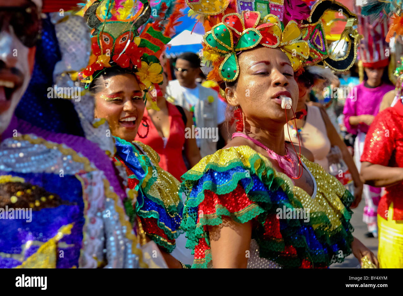 A Colombian Woman Wearing A Colorful Costumes Blows The Whistle