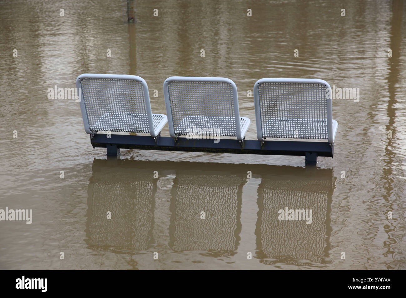 flooded bench at the beach of the river Danube, Lower Bavaria, Germany ...