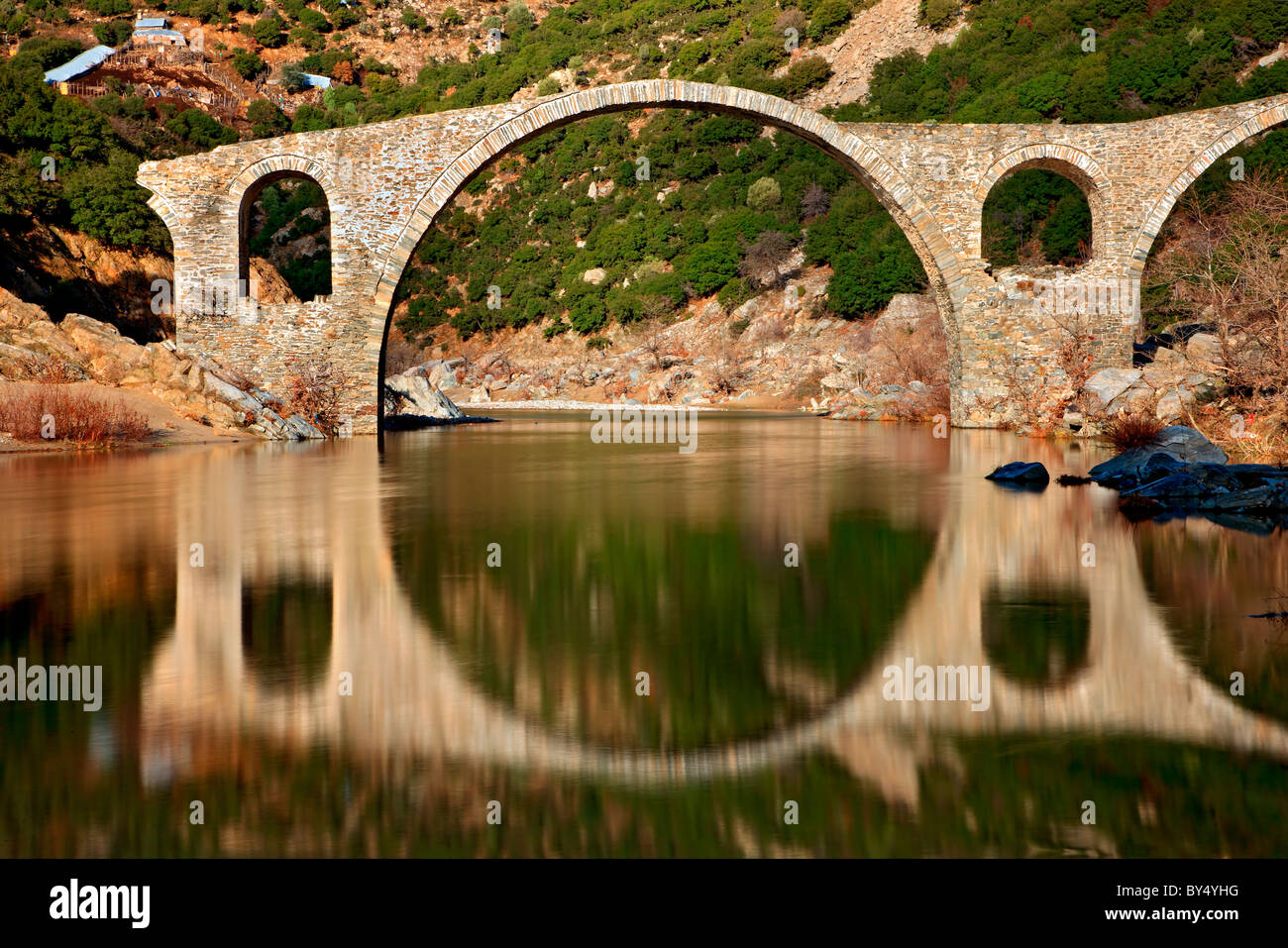 Greece, Thrace, Rodopi prefecture. The old, stone, arched, bridge, of ...