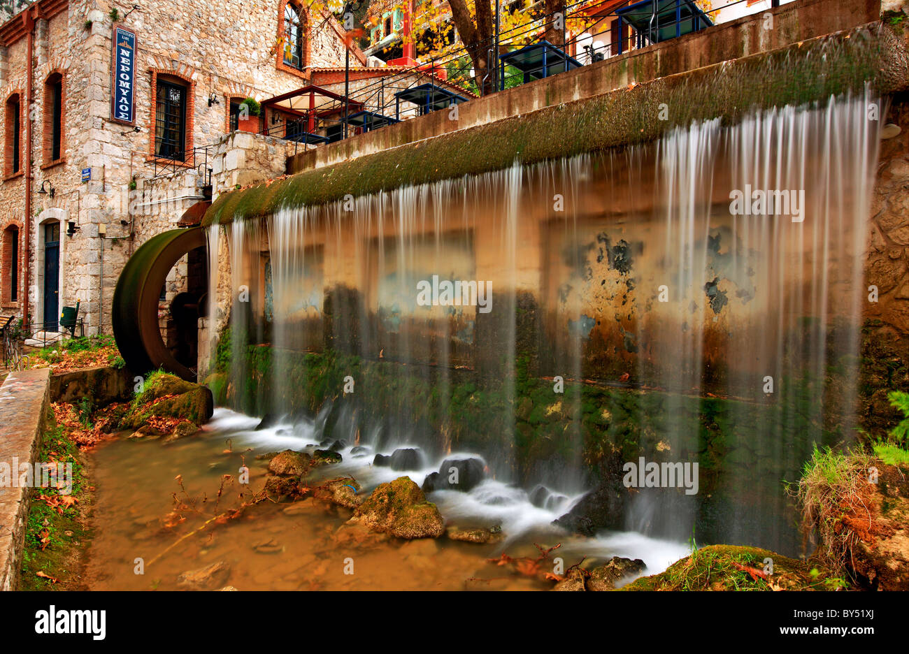 Greece, Livadia, Voiotia prefecture. A small waterfall and an old ...