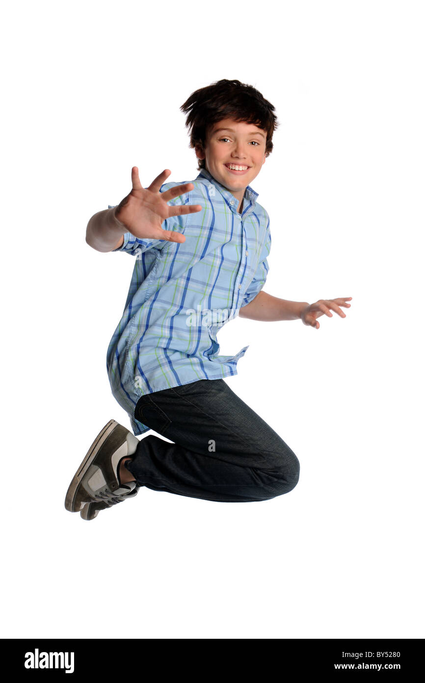 Young boy jumping isolated over white background Stock Photo - Alamy
