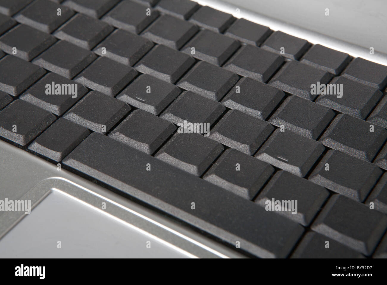 close up detail image of a laptop keyboard with all the letters, symbol ...