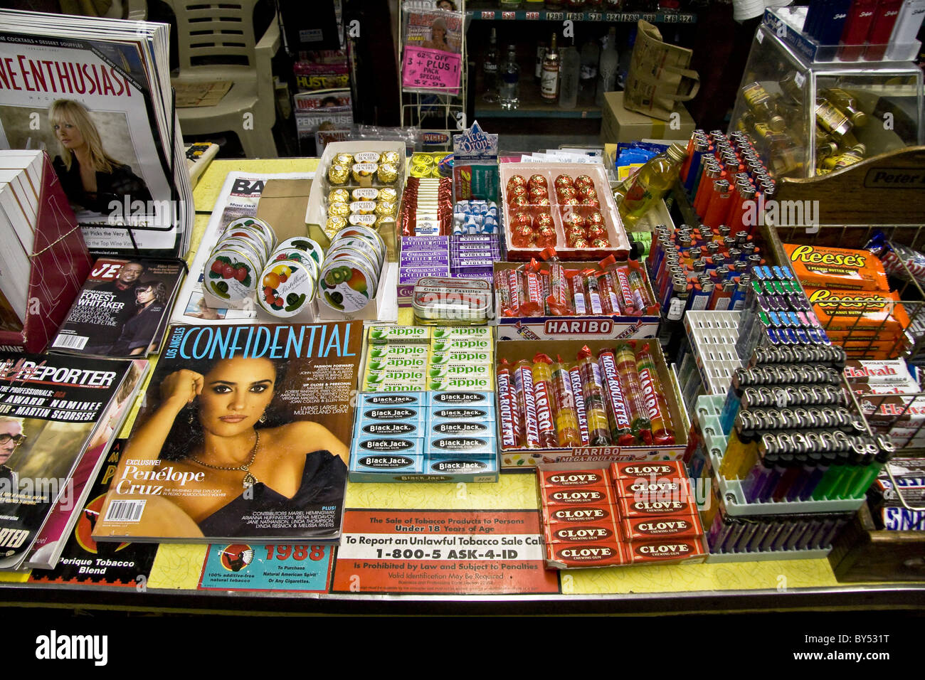 Magazines, gum, candies displayed on store counter Stock Photo - Alamy