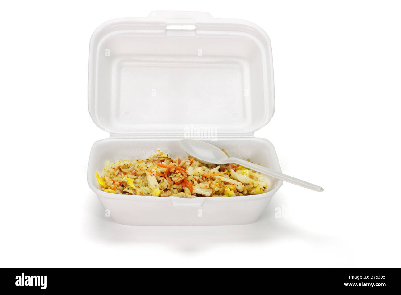 Fried rice in Styrofoam box with plastic disposable spoon on white ...