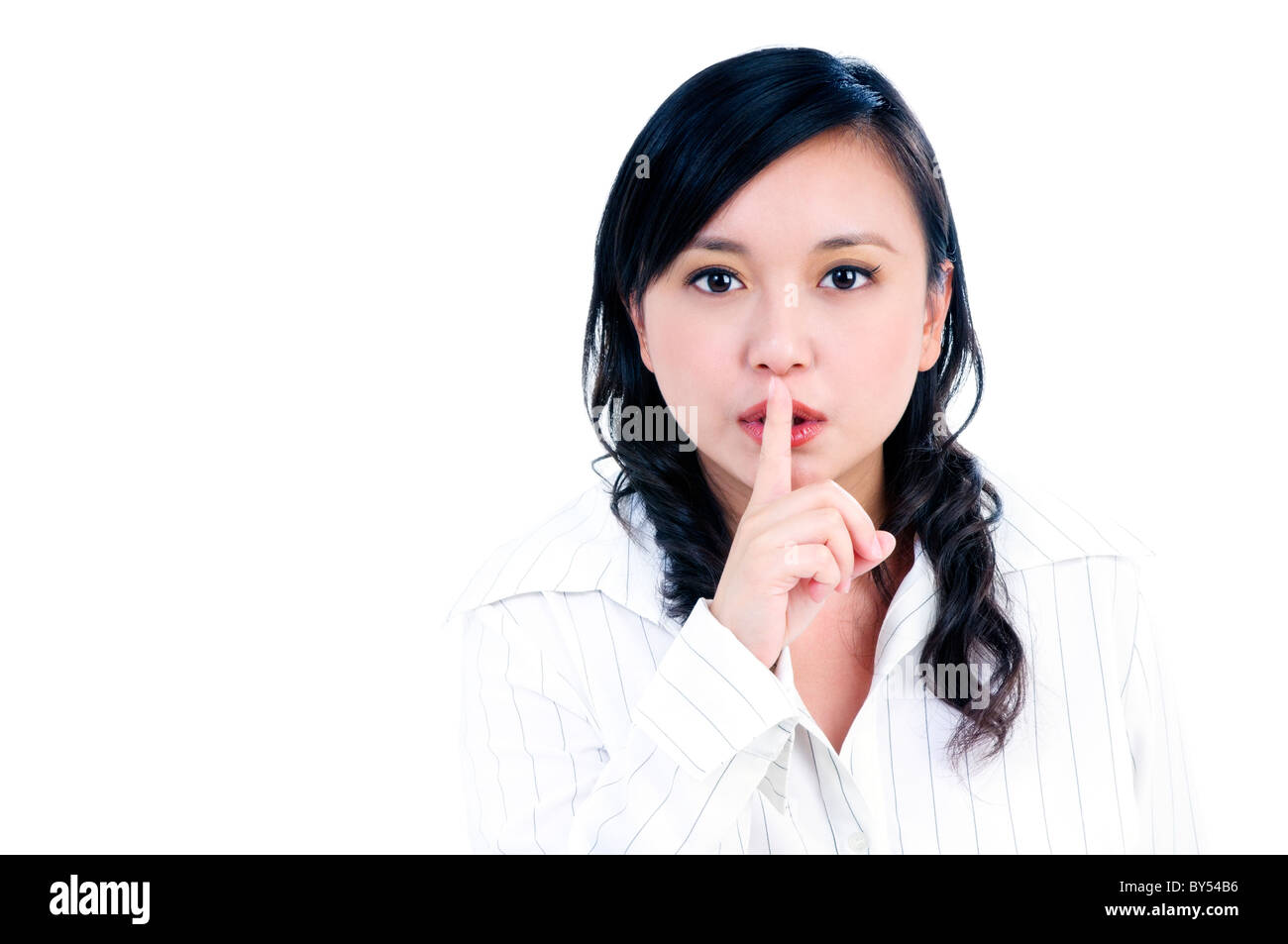 Girl putting finger lips hi-res stock photography and images - Alamy