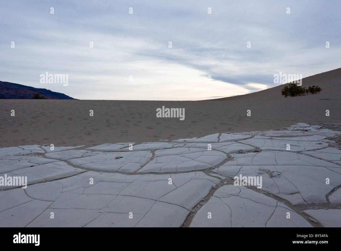 Dried mud cracks in the ancient lakebed of the Mesquite Flat Sand Dunes ...