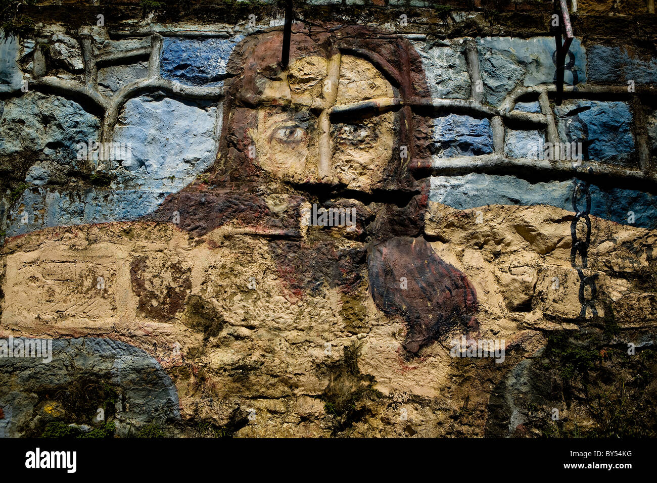 Painting of Jesus Christ on a brick wall in Barichara, Colombia Stock ...