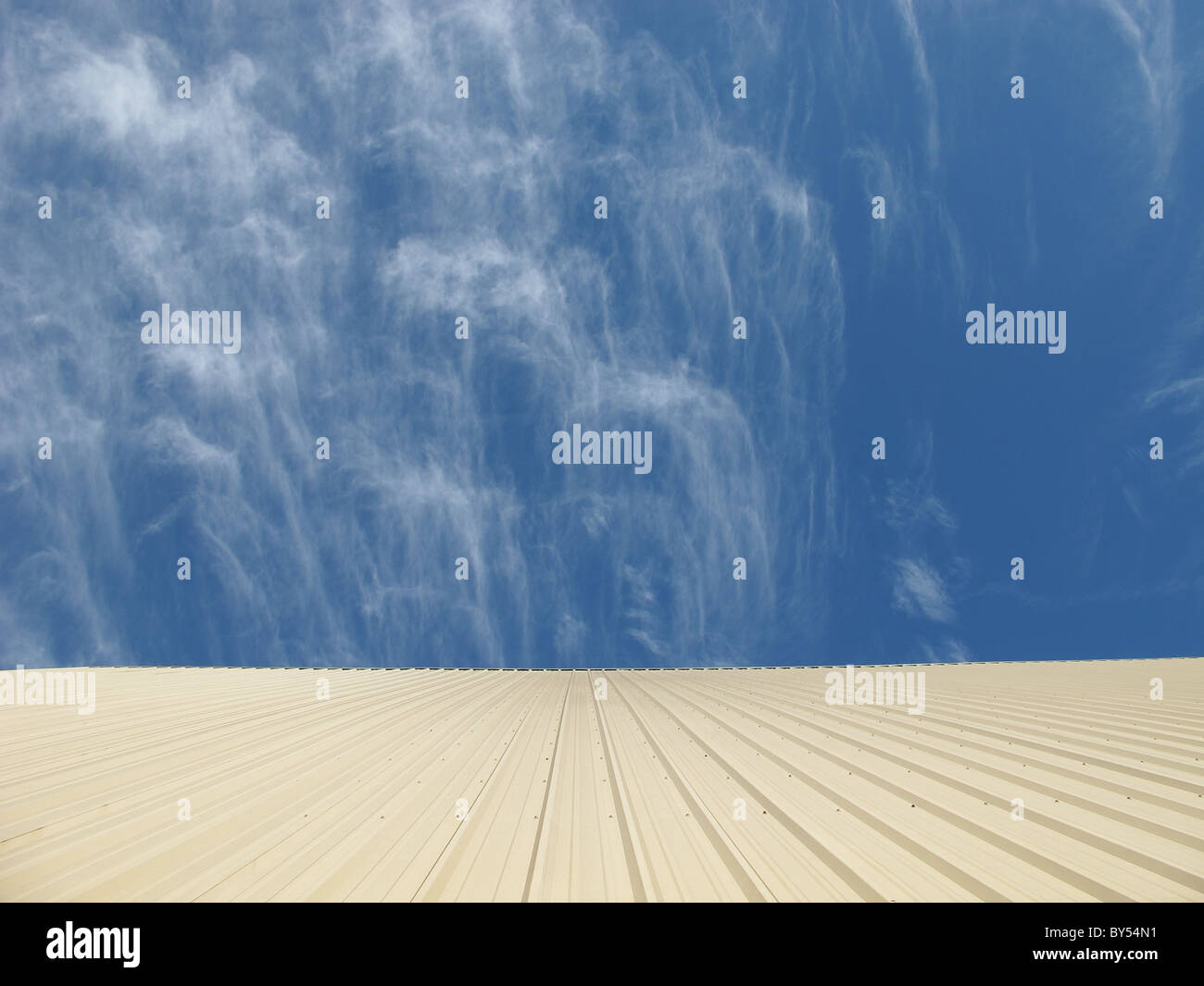 Blue Sky, white clouds and tan metal roof, abstract background Stock ...