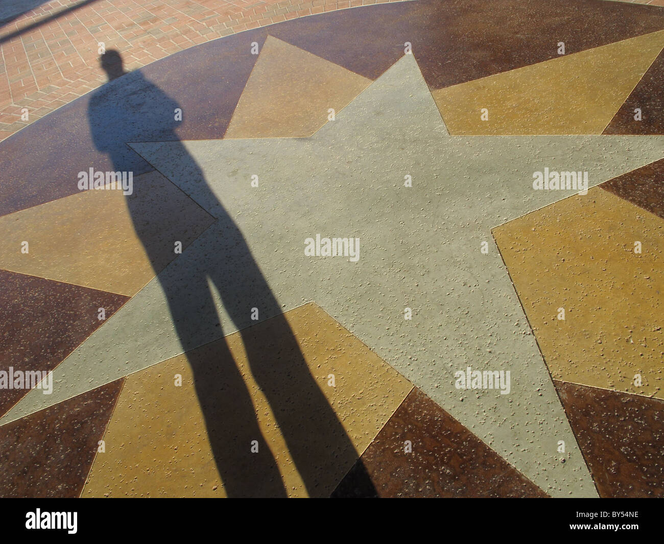 Shadow on compass shape Stock Photo - Alamy