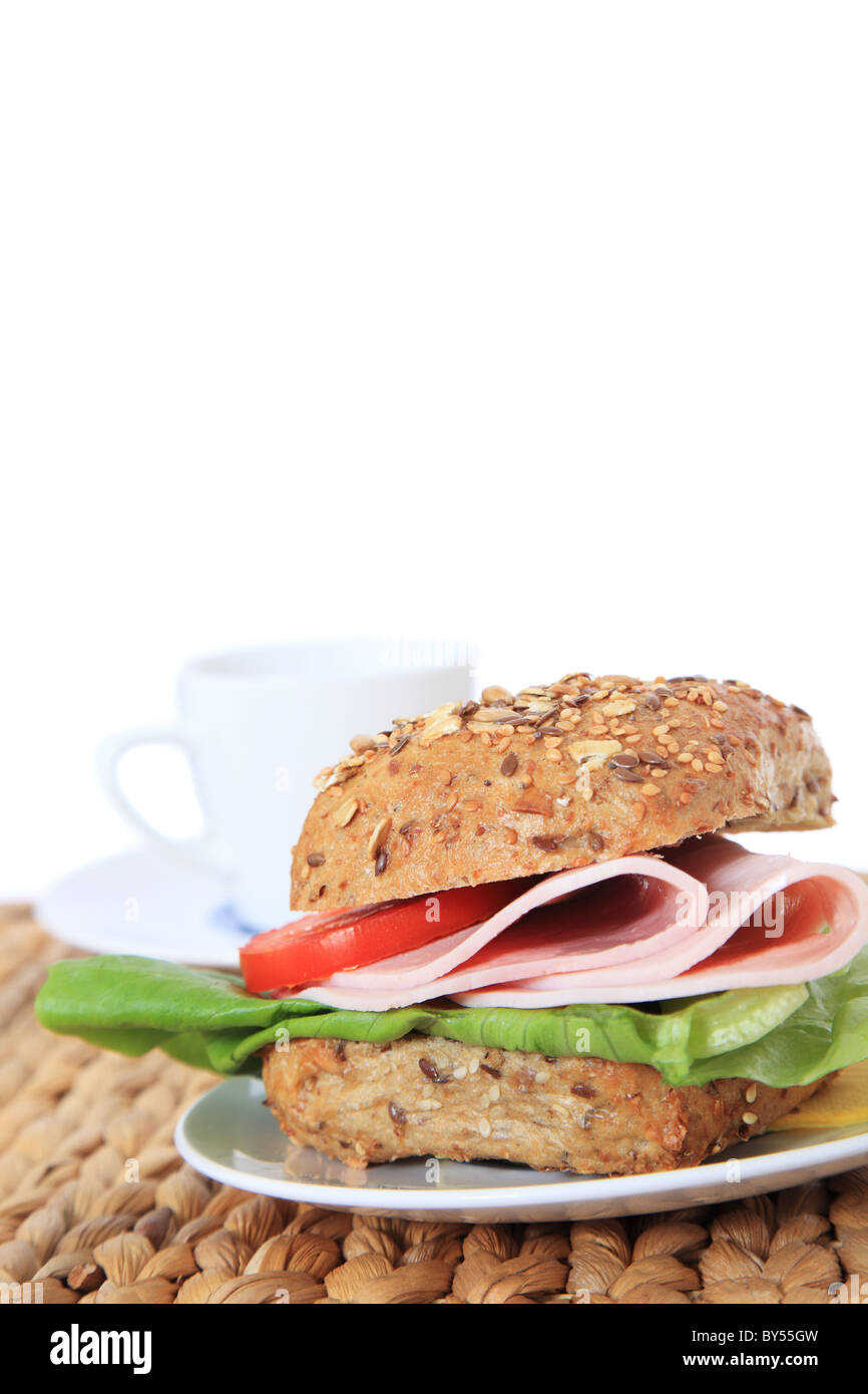 Fine served multi-grain roll with boiled ham. All on white background ...