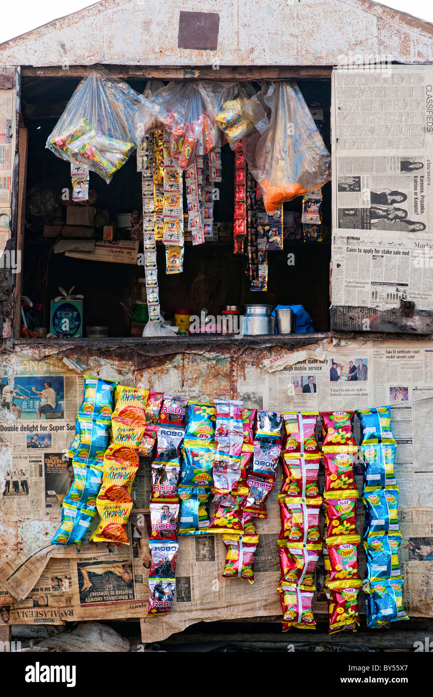 Dirty indian shop / shack selling packets of crisps on the road side ...