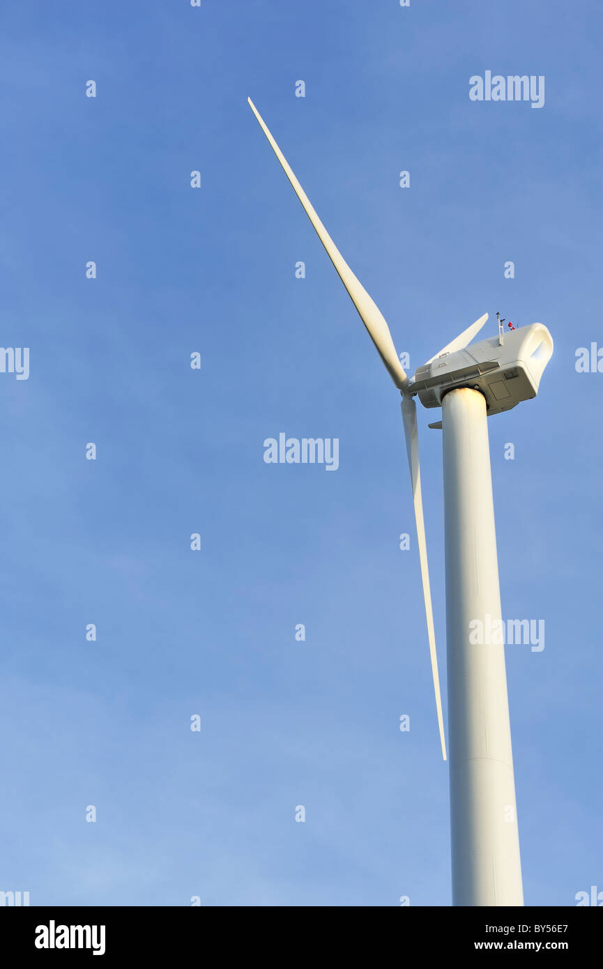 Side view of eco friendly wind turbine against a blue sky. Nantucket ...