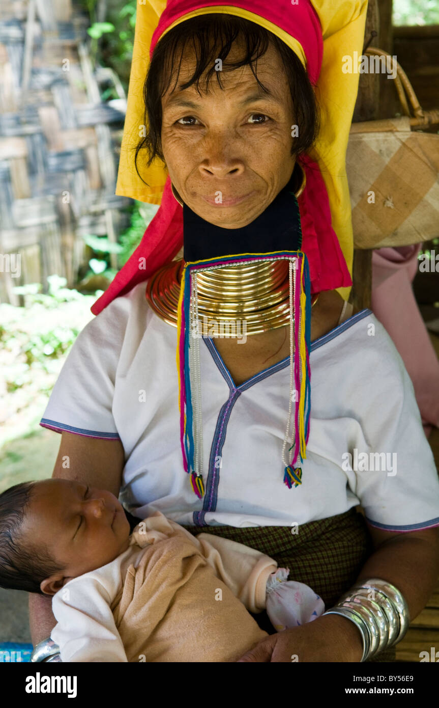 A Padong ( long neck ) woman holding her baby Stock Photo - Alamy