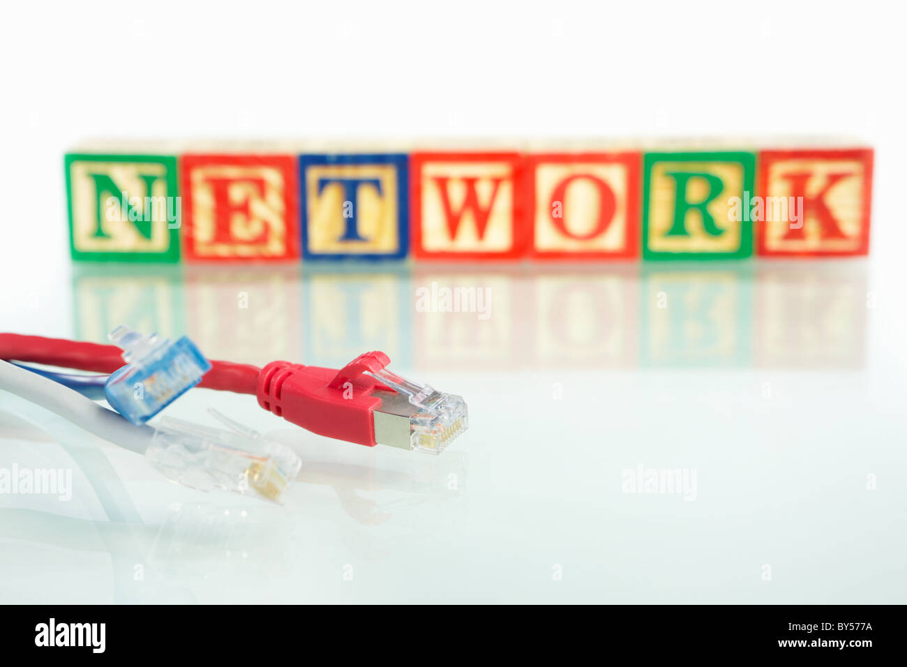 Word 'Network' from blocks behind Lan cables Stock Photo - Alamy