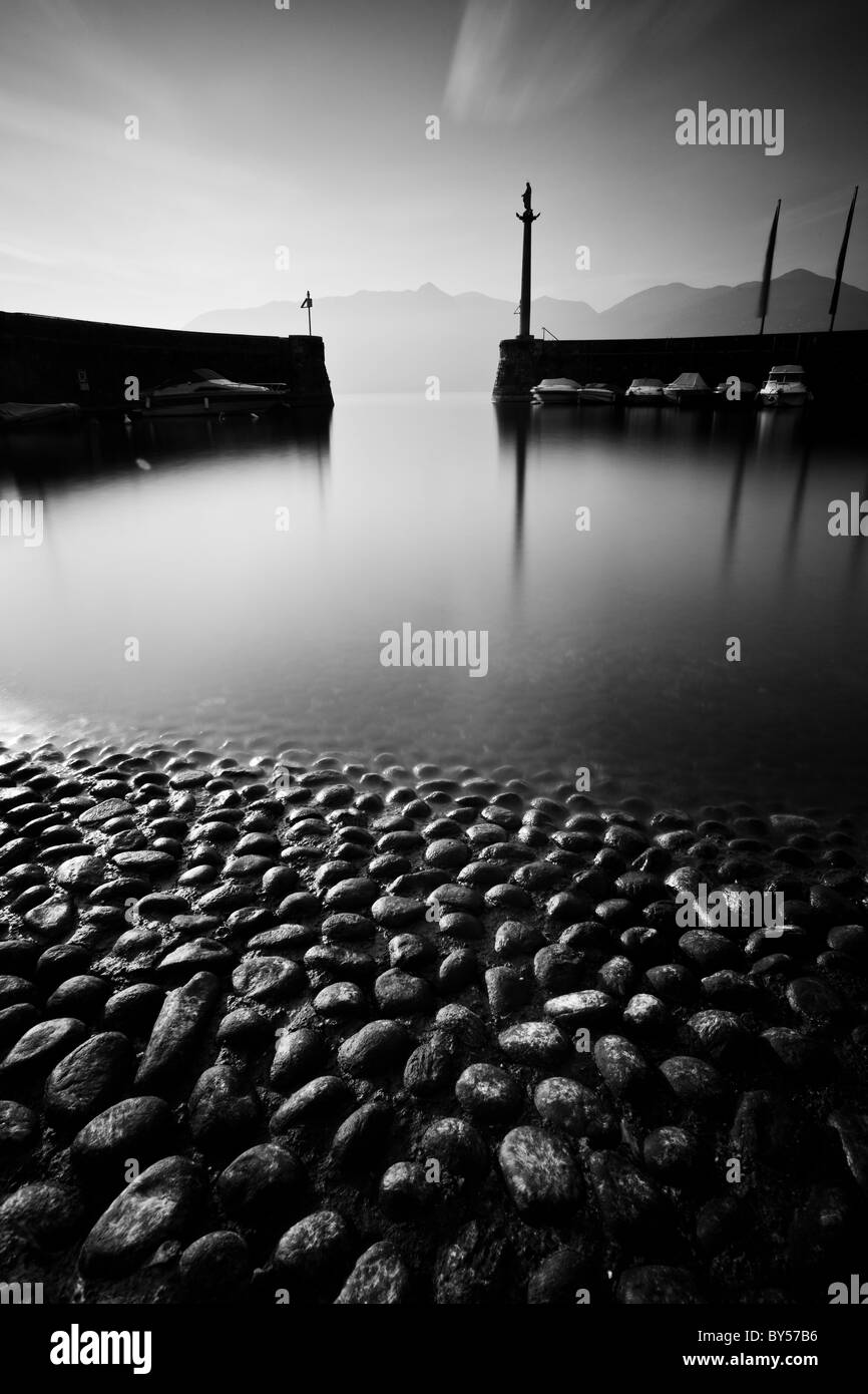 small lake port and mountains in background Stock Photo - Alamy