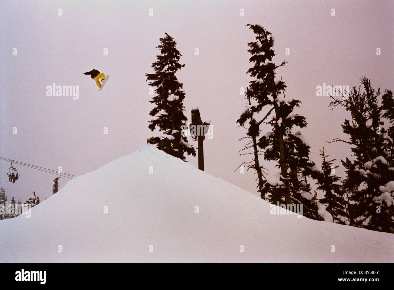 A snowboarder in mid-air Stock Photo - Alamy