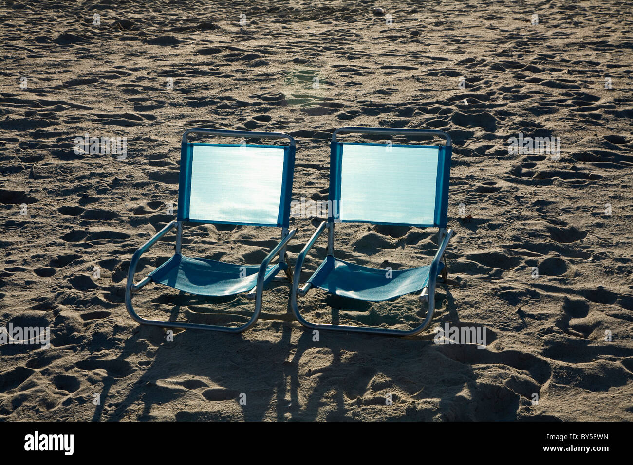 Two empty chairs on a beach Stock Photo - Alamy