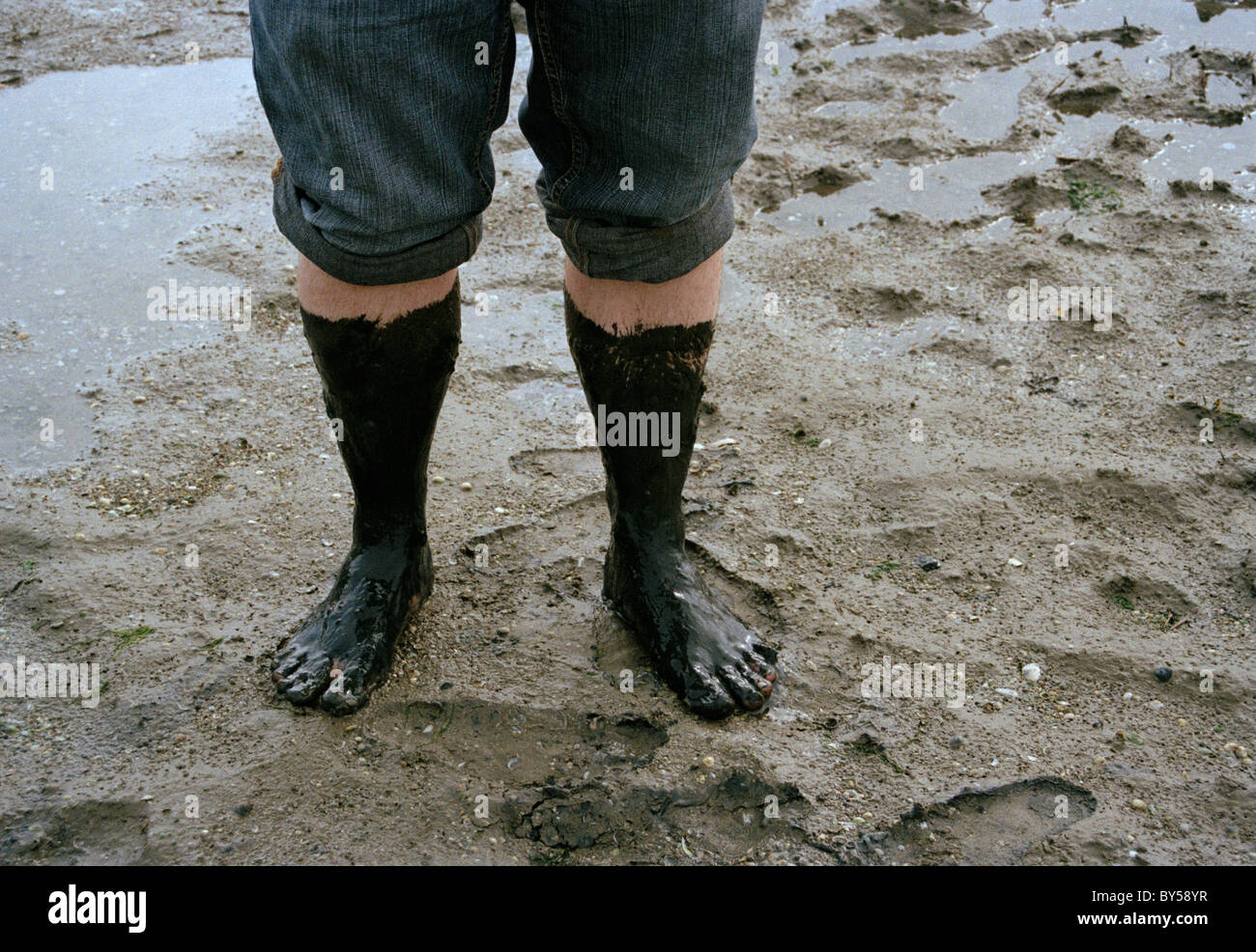 Muddy feet on a wet beach Stock Photo - Alamy