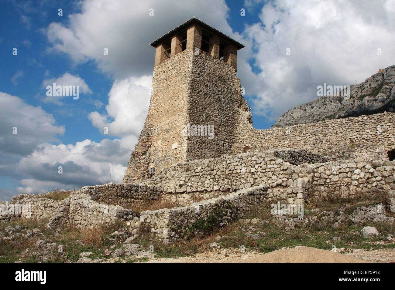 Albania, Kruja, Exterior of stone watchtower at Kruja Castle against a ...