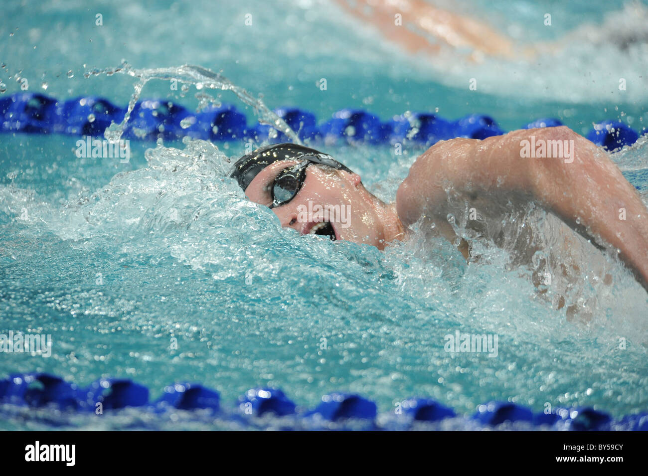 India Delhi 2010 XIX Commonwealth Games swimmer in pool doing front ...