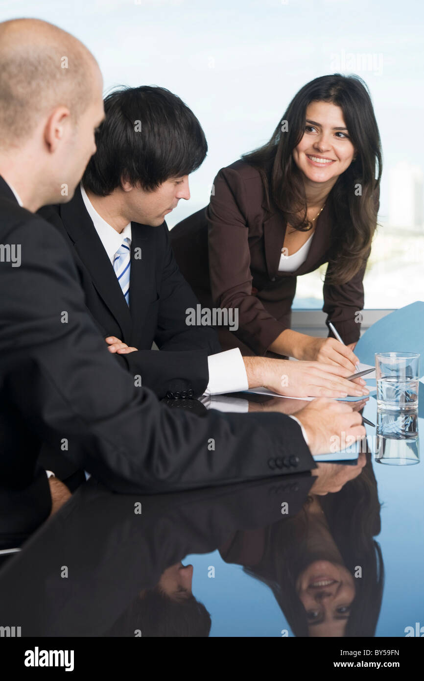 Customer talk at a nice table, two businessman and one businesswoman ...