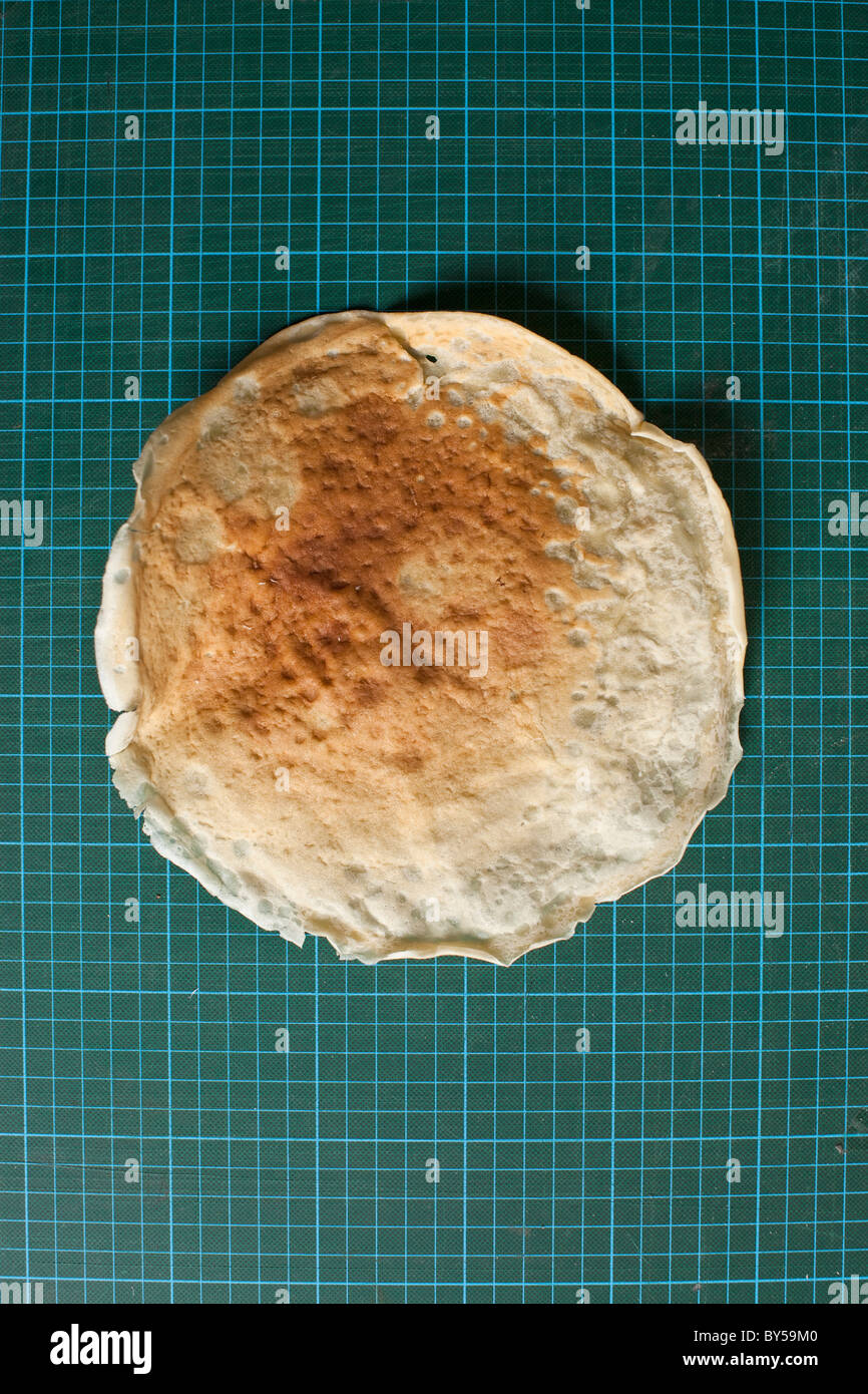 A pancake on top of a grid Stock Photo - Alamy