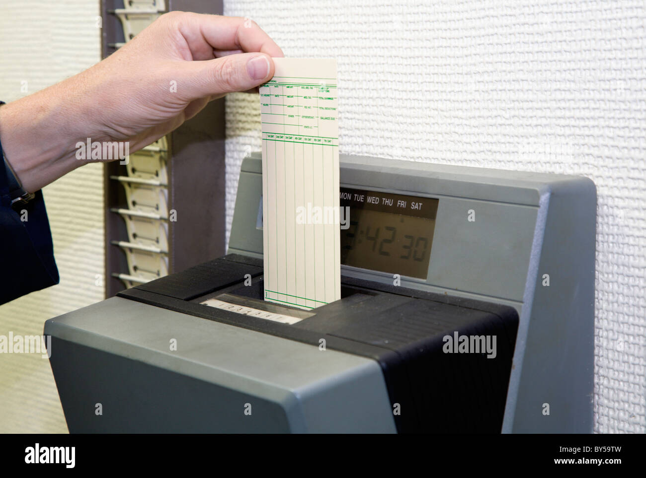 Punch clock office hi-res stock photography and images - Alamy