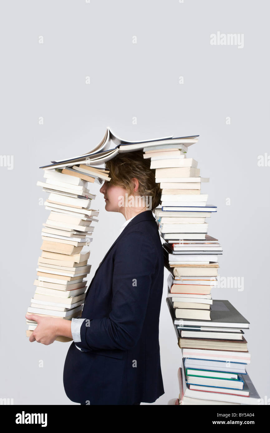 Surrounded by books hi-res stock photography and images - Alamy