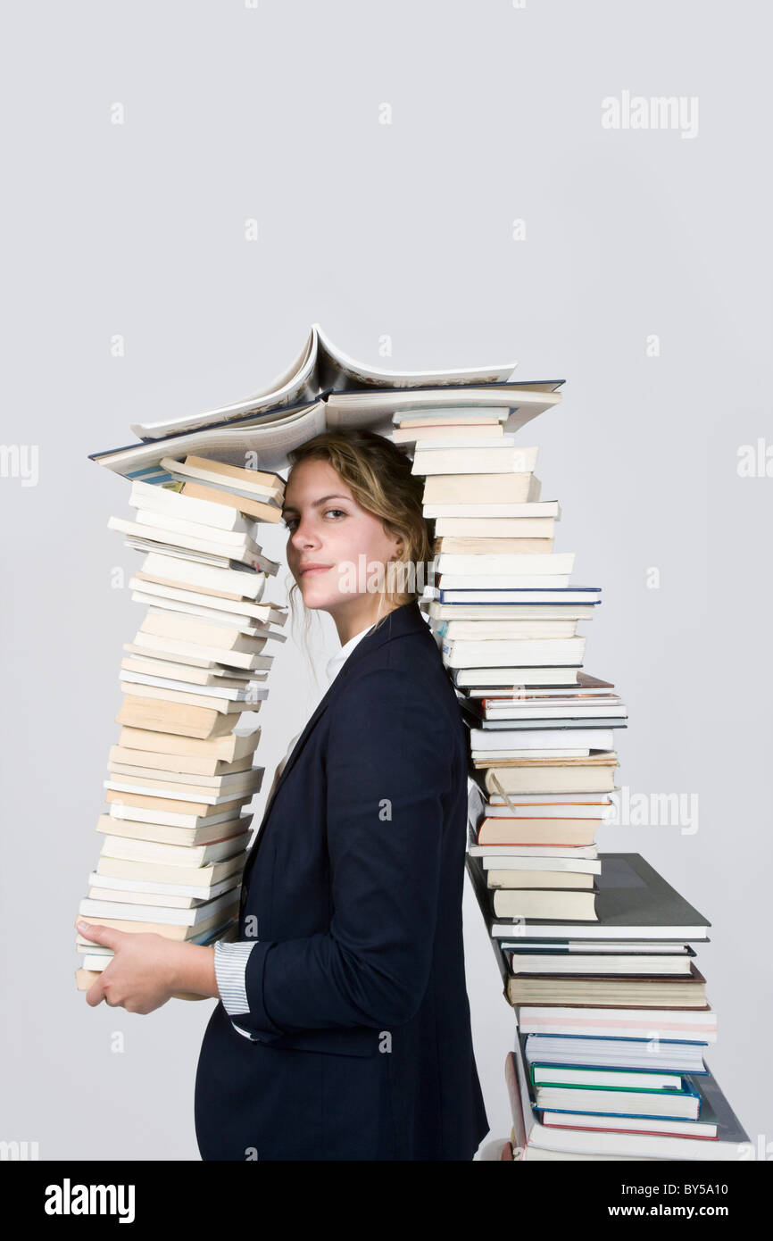Person looking at books hi-res stock photography and images - Alamy