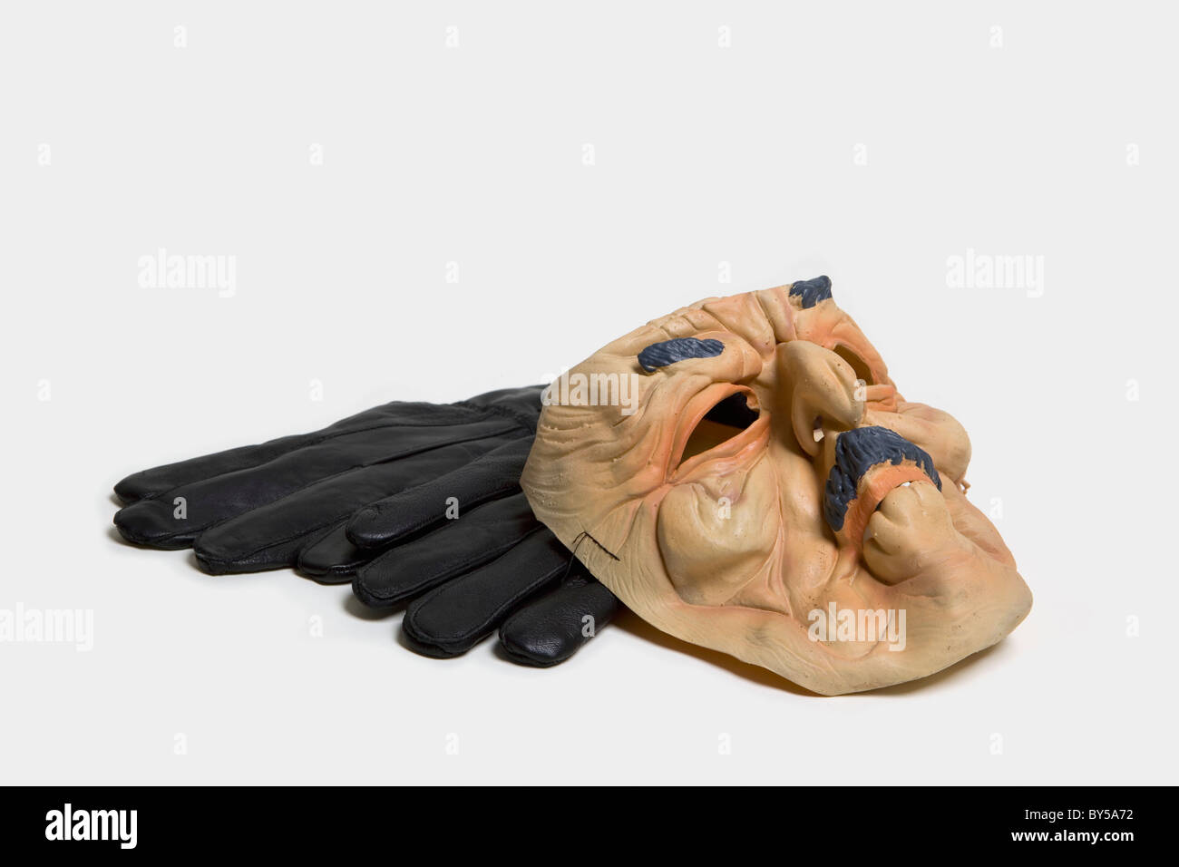 A rubber mask and a pair of gloves Stock Photo - Alamy