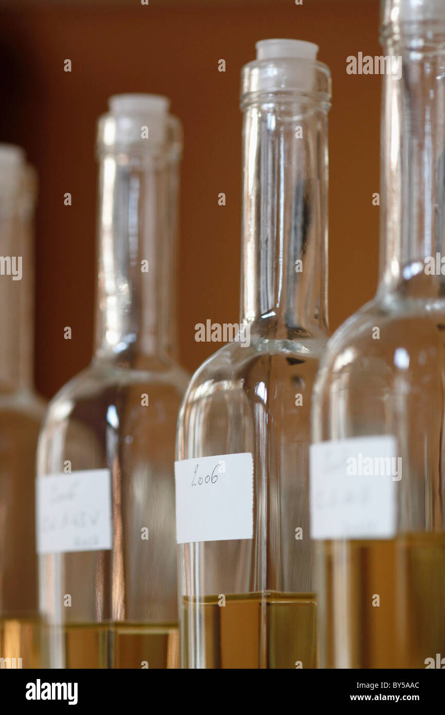 Detail of bottles of white wine Stock Photo - Alamy