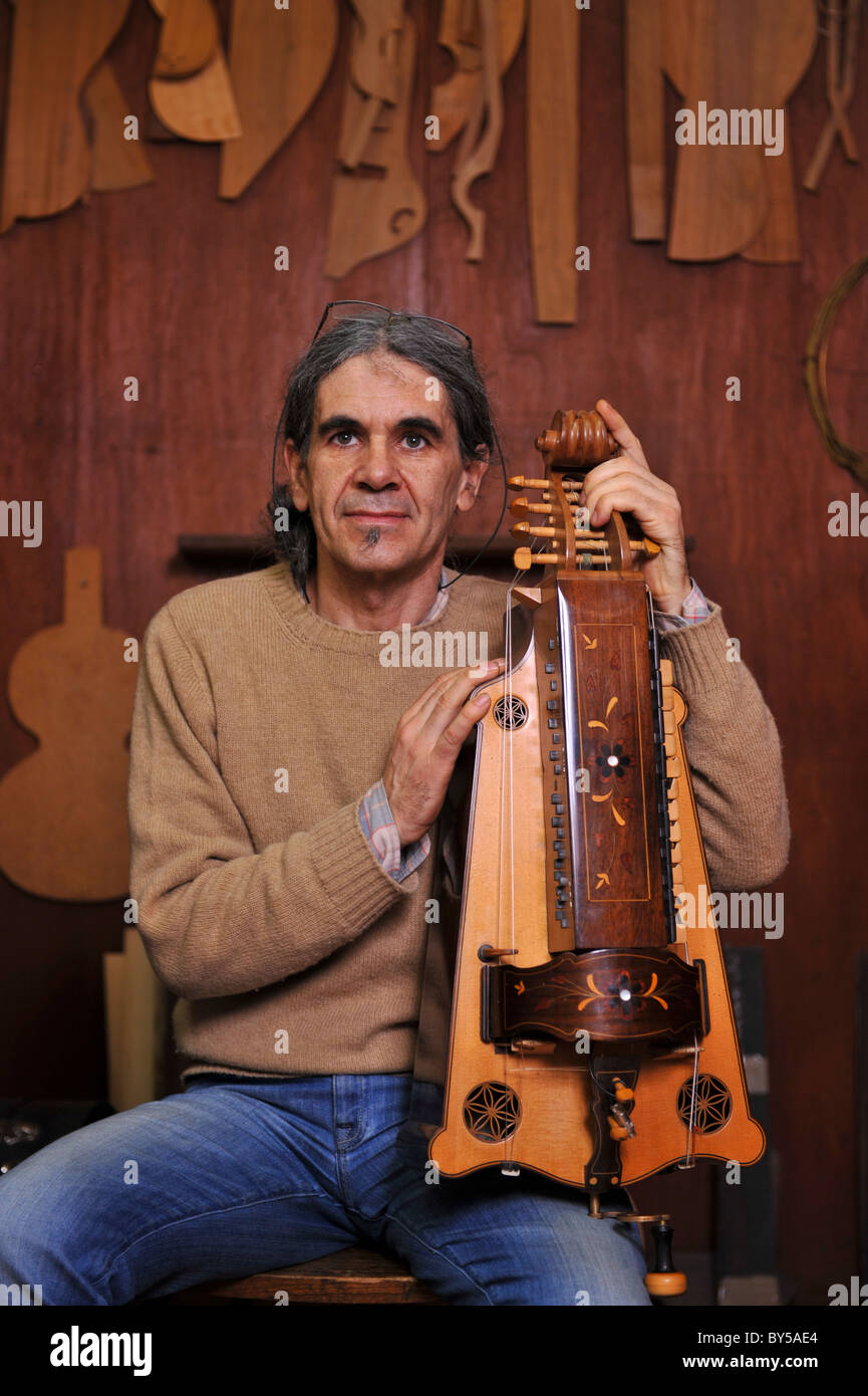 Portrait of a craftsman holding a Sanfona traditional portuguese ...