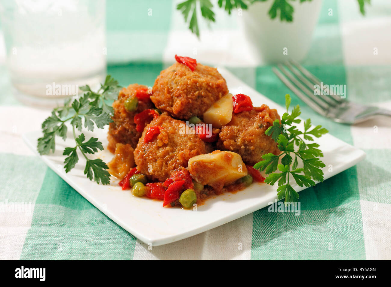 Chicken meatballs with squid. Recipe available Stock Photo - Alamy