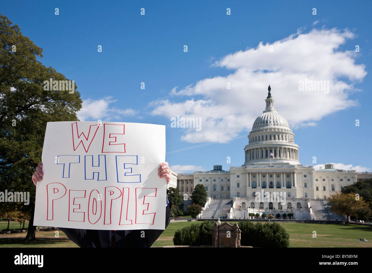 Standing holding placard architecture social issues protestor western ...
