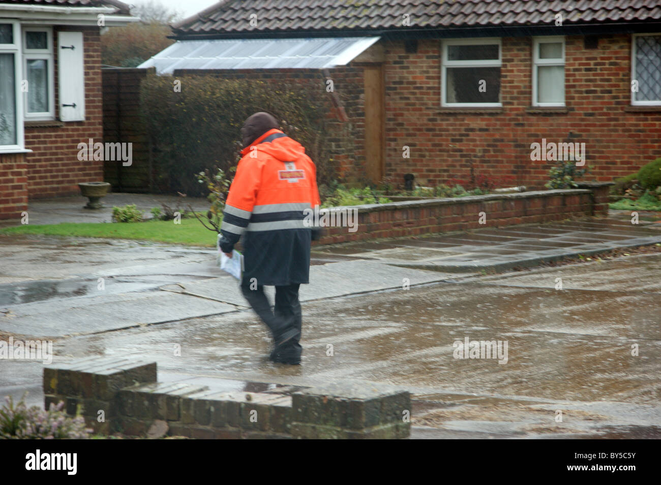 Postman on round delivering letters hi-res stock photography and images ...