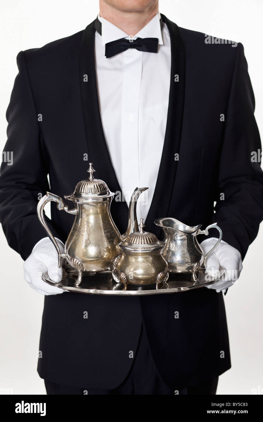 Butler serving tea hi-res stock photography and images - Alamy