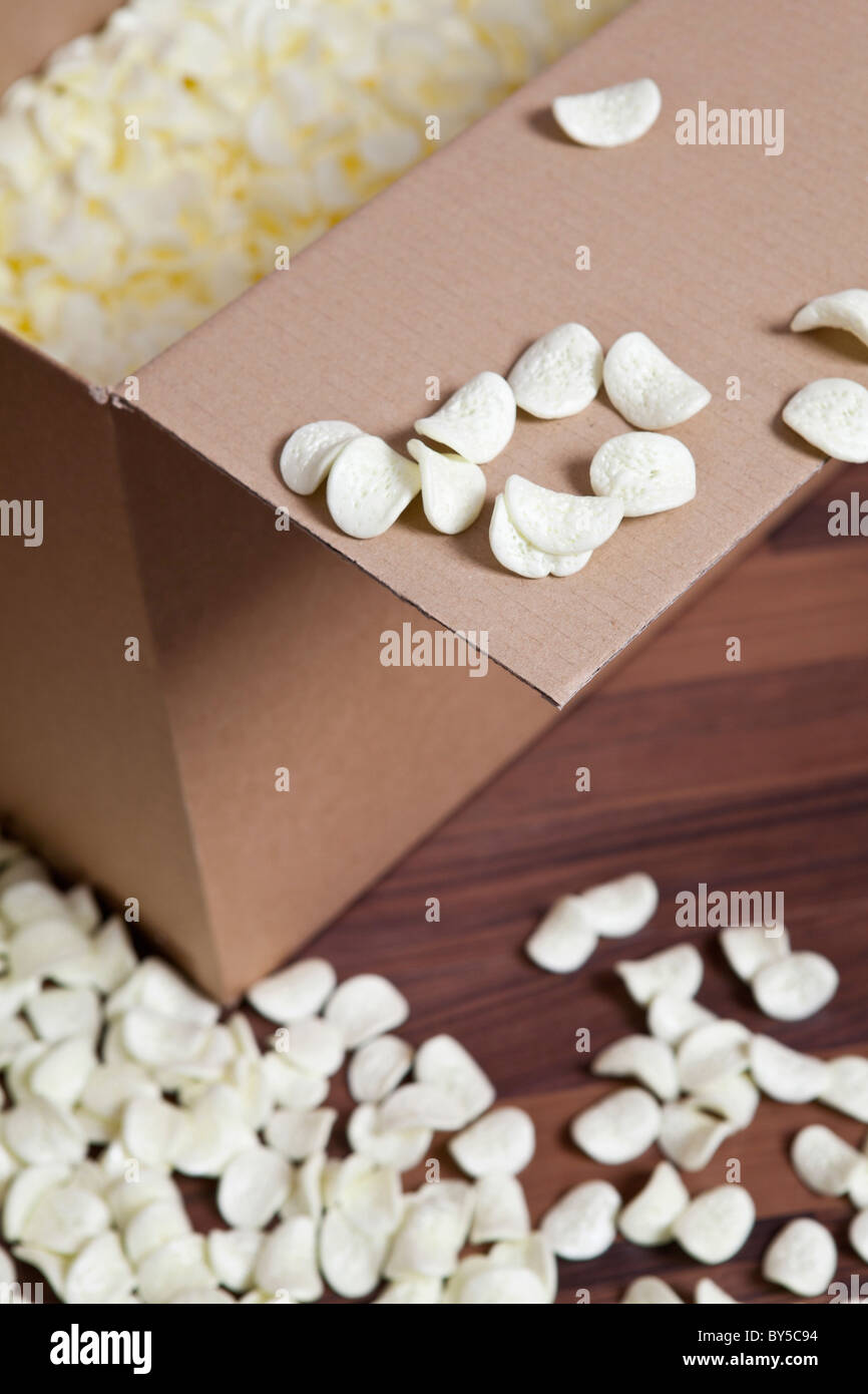 A cardboard box and packing peanuts Stock Photo - Alamy