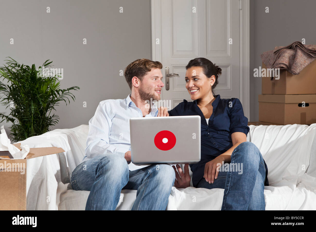 A couple taking a break from moving Stock Photo - Alamy