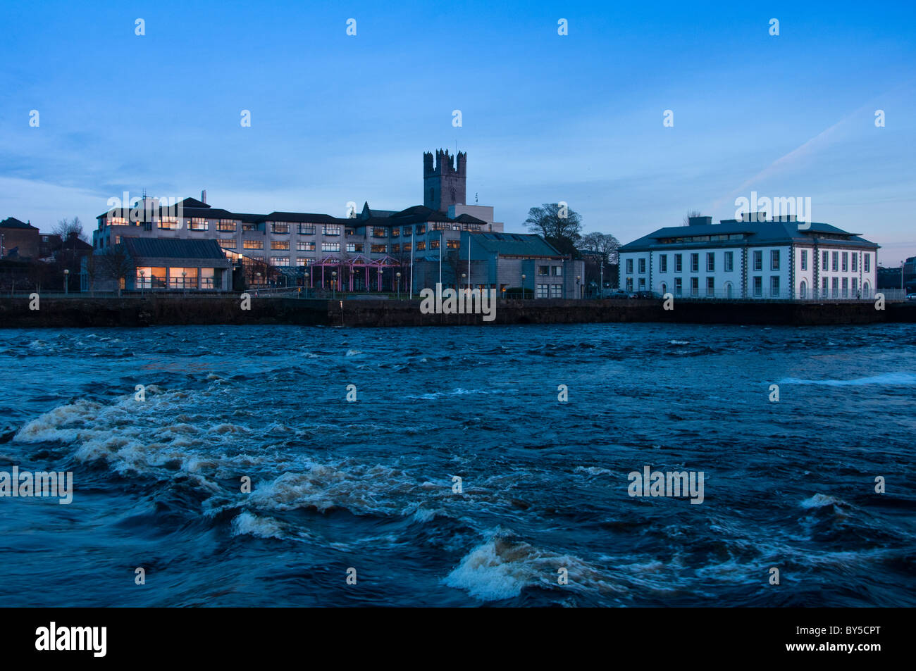 Limerick city hall, courthouse and St Peter's Cathedral at nightfall ...