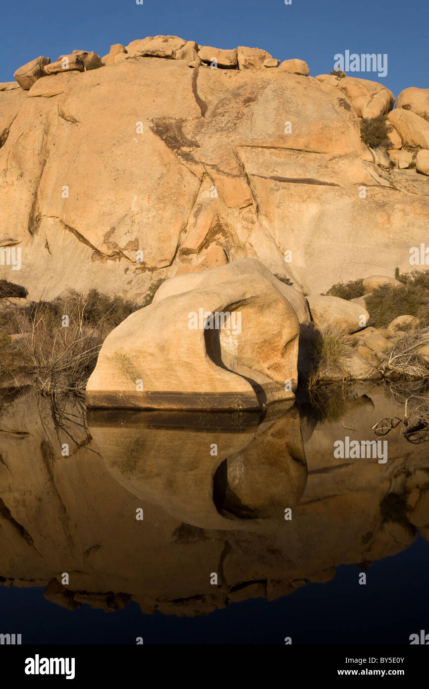 Rock formations reflecting in the reservoir at Barker Dam or Big Horn ...