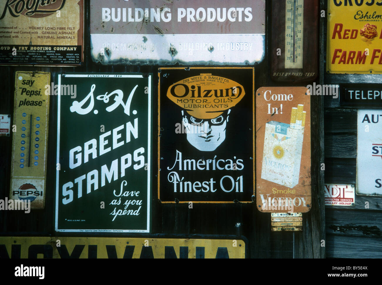 A collection of antique signs at a rural roadside display in Maryland ...