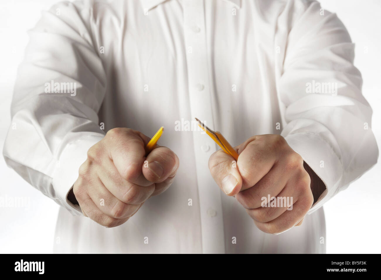 Hands breaking pencil hi-res stock photography and images - Alamy